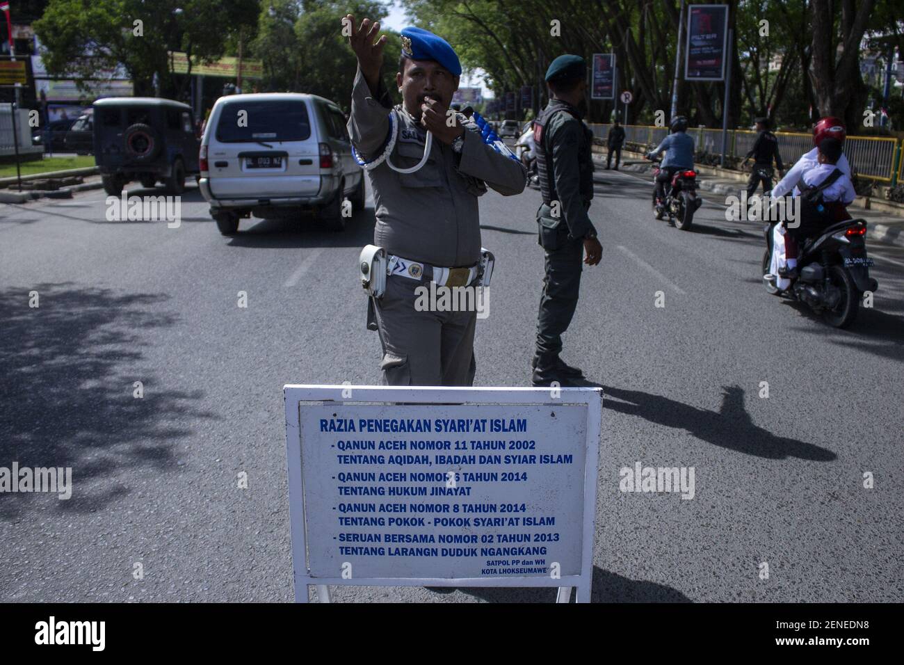 Islamic Sharia police regulate traffic during the enforcement. Dozens ...