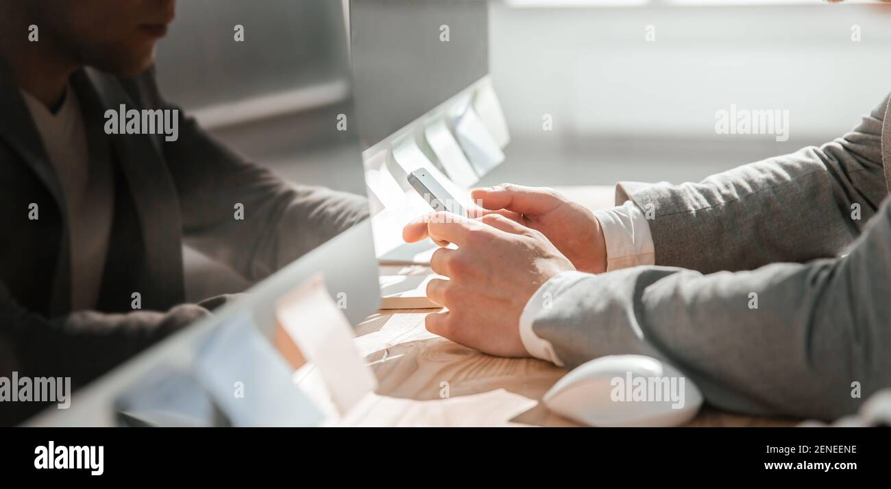 close up.group of employees sitting at a Desk Stock Photo - Alamy