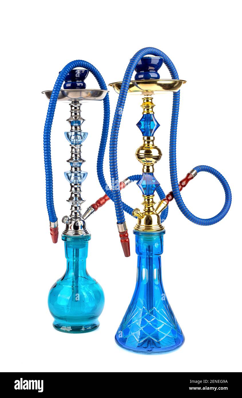Two hookahs shishas with blue glass flask and metal bowl on a white ...