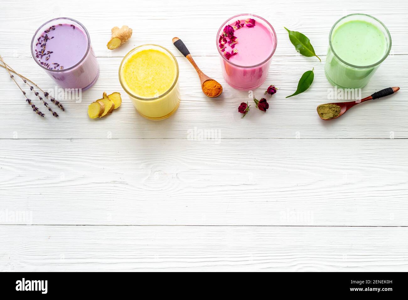 Green, yellow and pink latte. Hot colorful coffee or tea with milk ...
