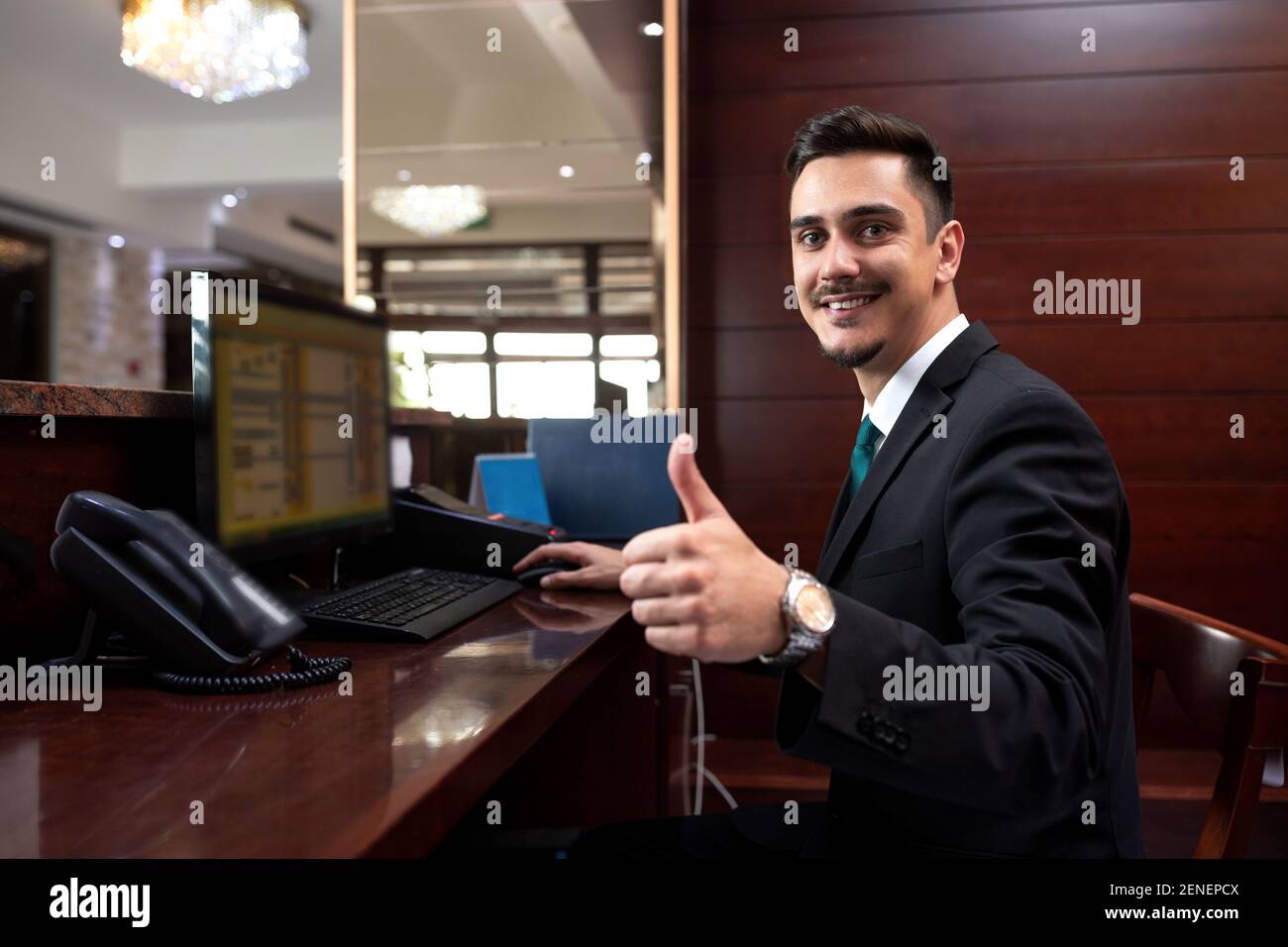 Receptionist work behind counter hi-res stock photography and images ...