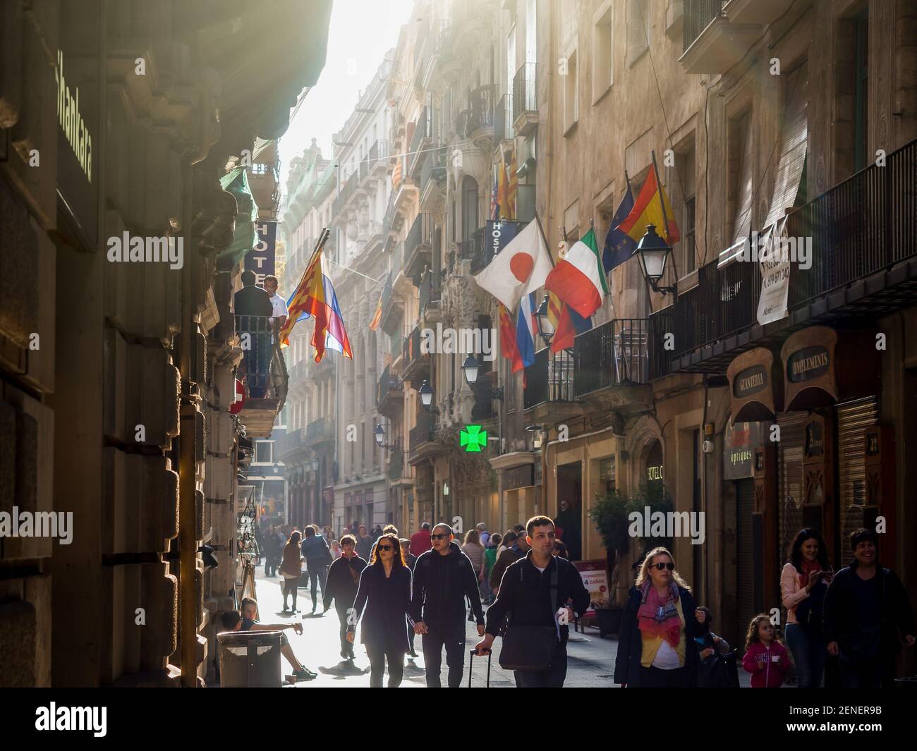 Busy summer street scene in the back alleyway of Barcelona La Rambla ...
