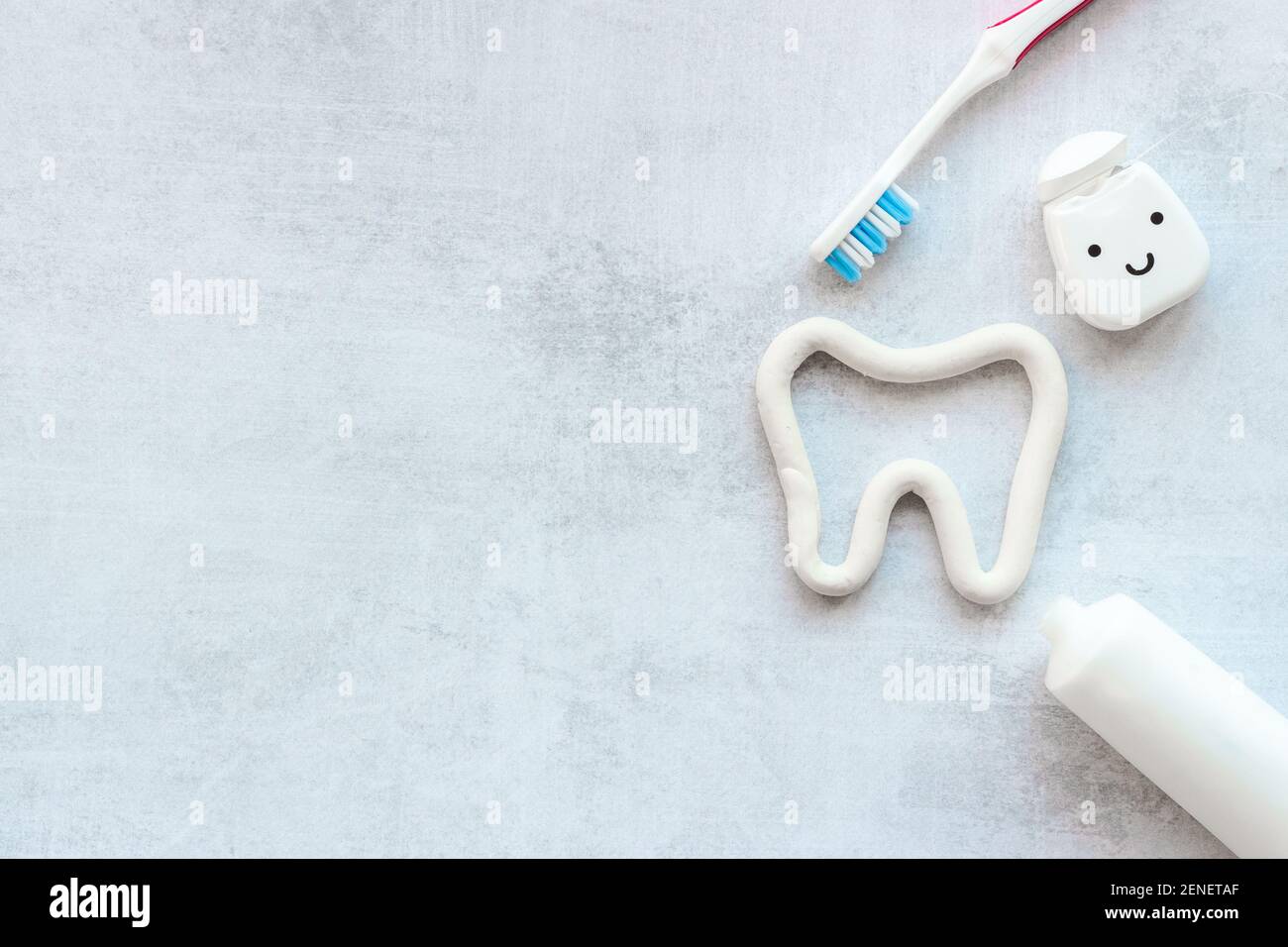 Tooth shape with tube of toothpaste and toothbrush. Dental hygiene ...