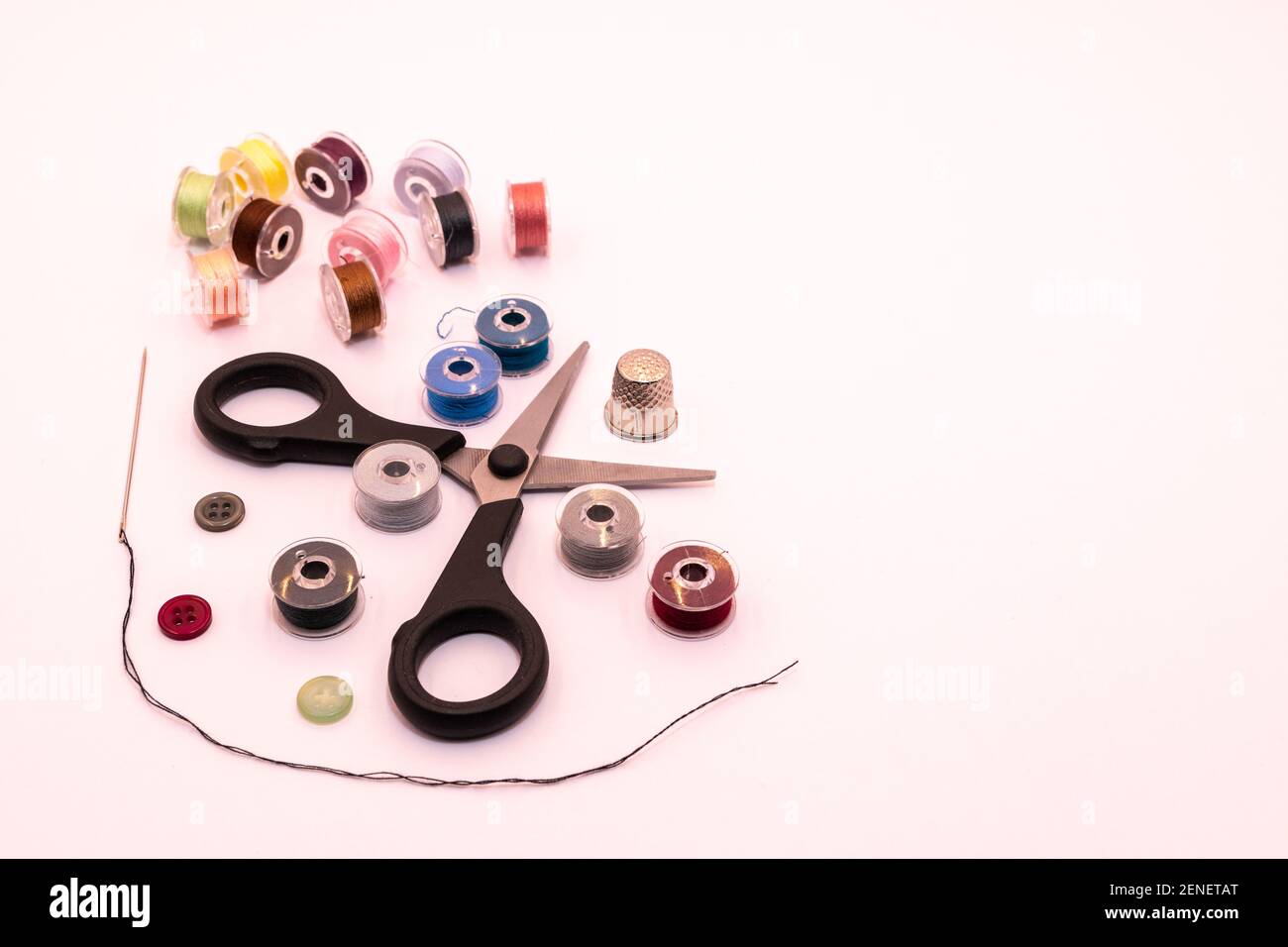 Photograph of sewing threads and sewing tools on white background Stock ...