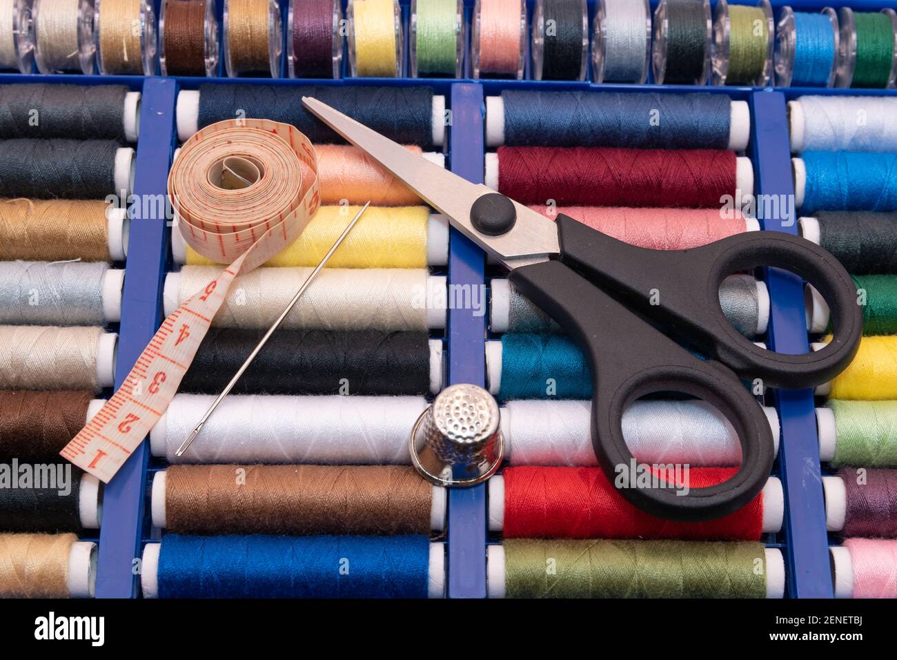 photography of different colored sewing threads and sewing tools Stock ...