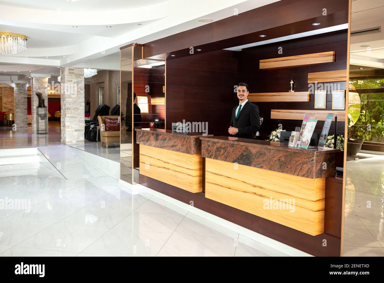 Receptionist at the desk of a high class hotel, fancy hotel Stock Photo ...