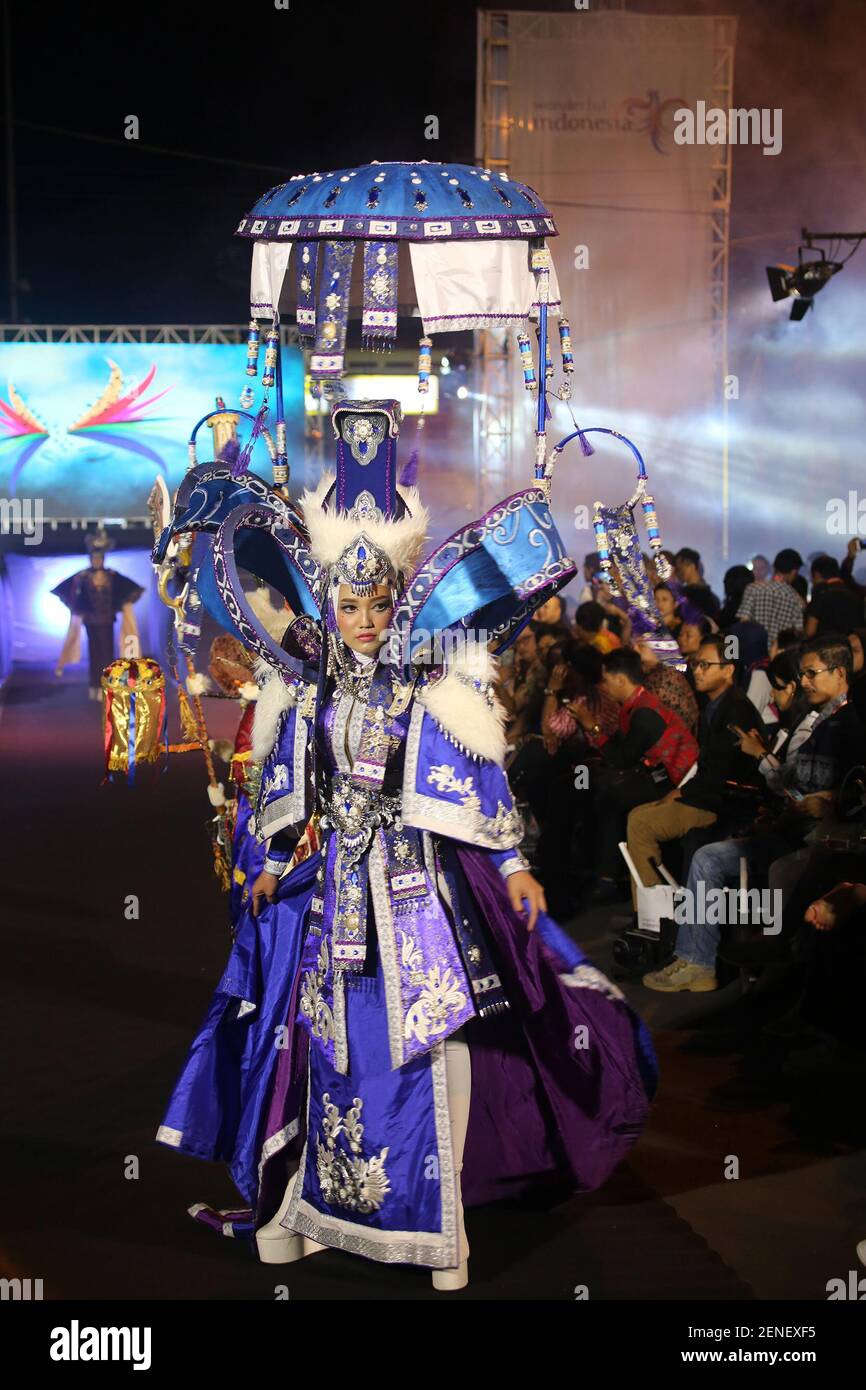 An Indonesian model walks the runway during the Jember Fashion Carnaval ...