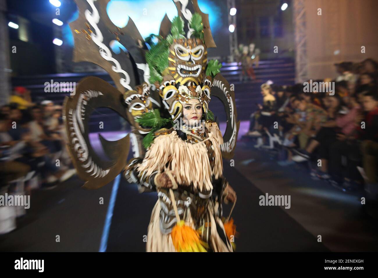 An Indonesian model walks the runway during the Jember Fashion Carnaval ...