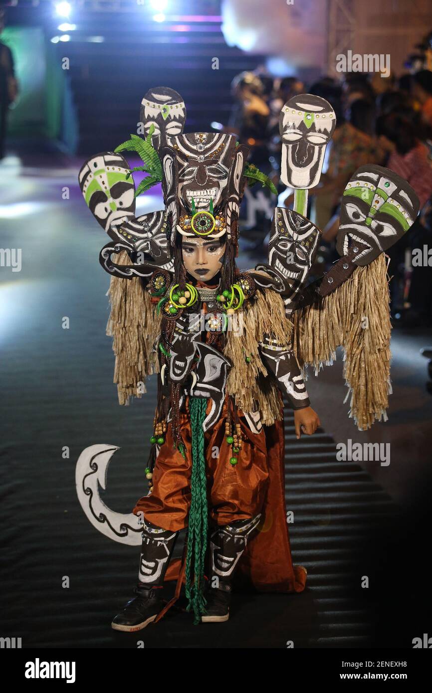 An Indonesian model walks the runway during the Jember Fashion Carnaval ...