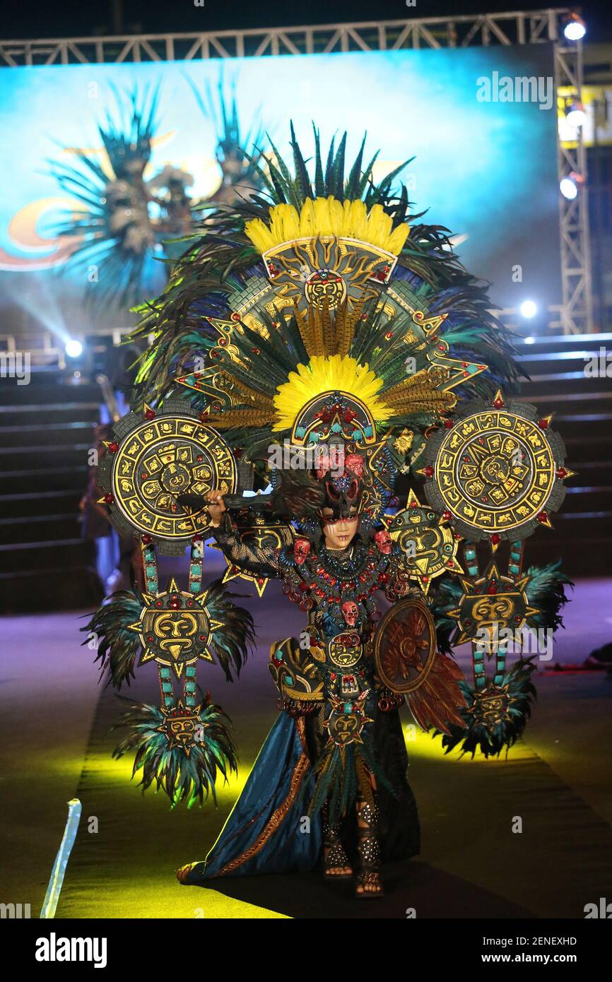 An Indonesian model walks the runway during the Jember Fashion Carnaval ...
