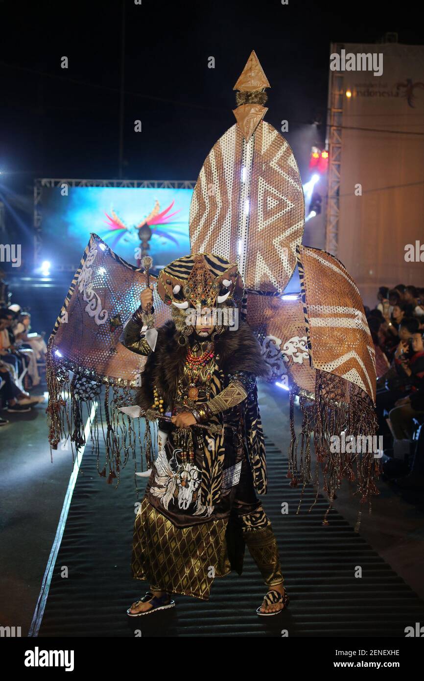 An Indonesian model walks the runway during the Jember Fashion Carnaval ...