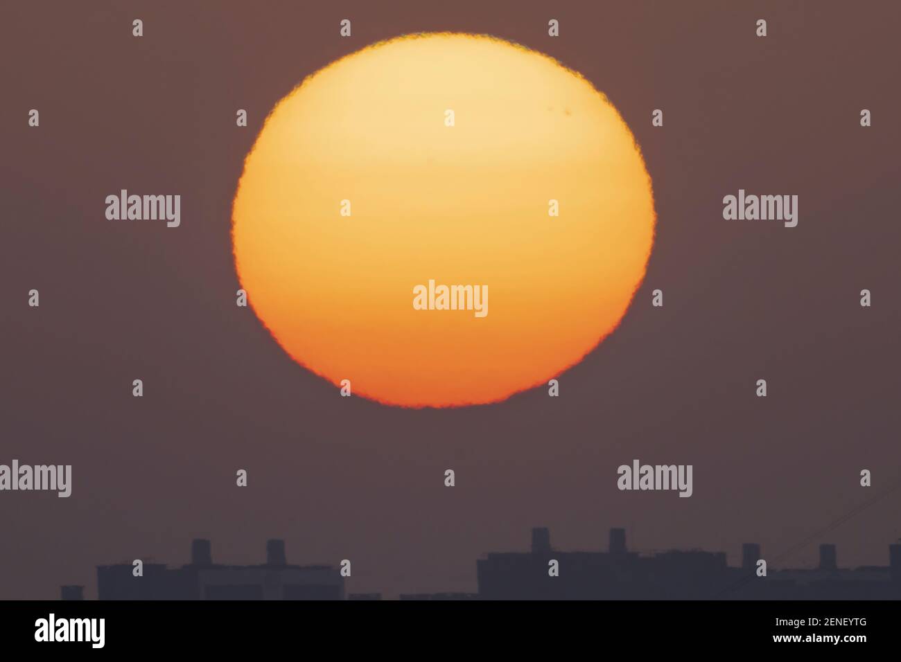 Sun disc in the sky at sunrise Stock Photo - Alamy