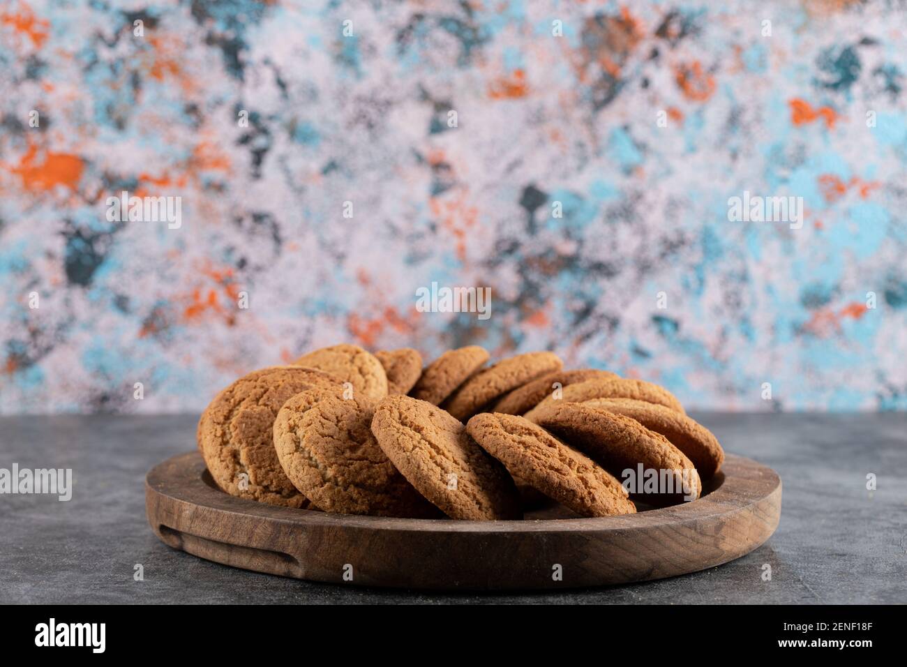 Close up photo of fresh homemade cookies on wooden tray. Delicious ...