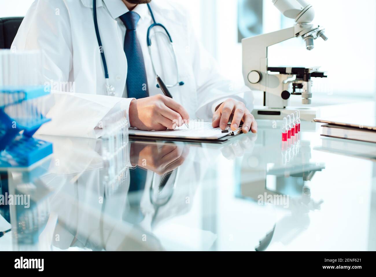 scientist making research records in a medical laboratory Stock Photo ...