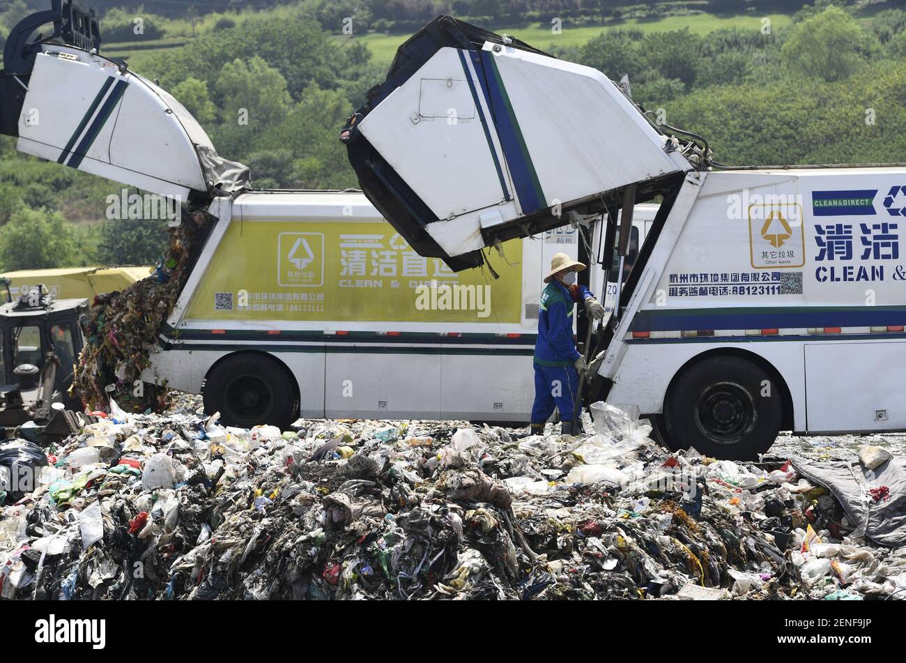 Chinese workers sort out and bury kitchen waste at the Tianziling ...
