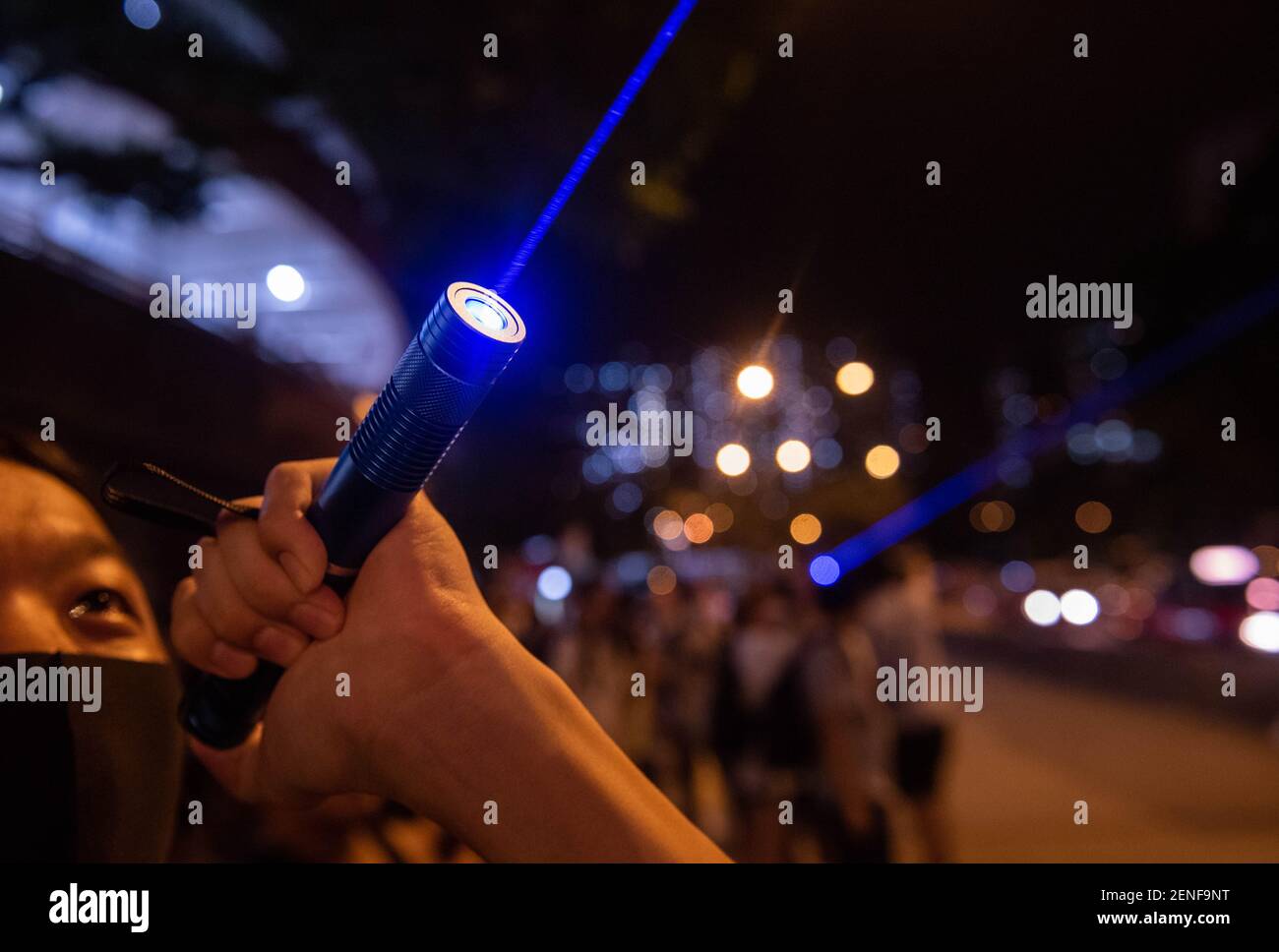 Protester use blue laser pointers against the riot police officers and ...