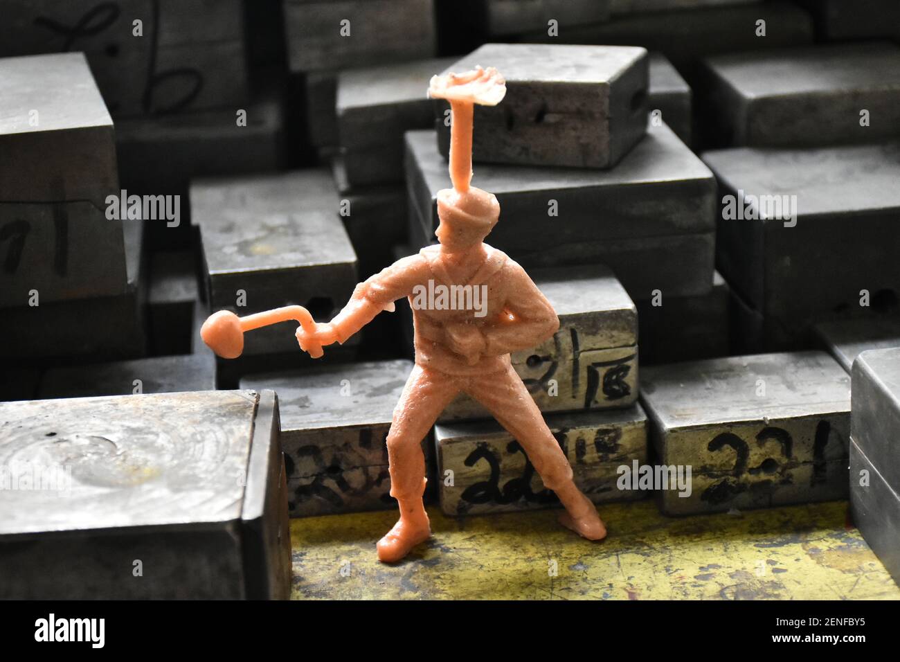 A man makes the manufacture of plastic figures, putting polymer in lead ...
