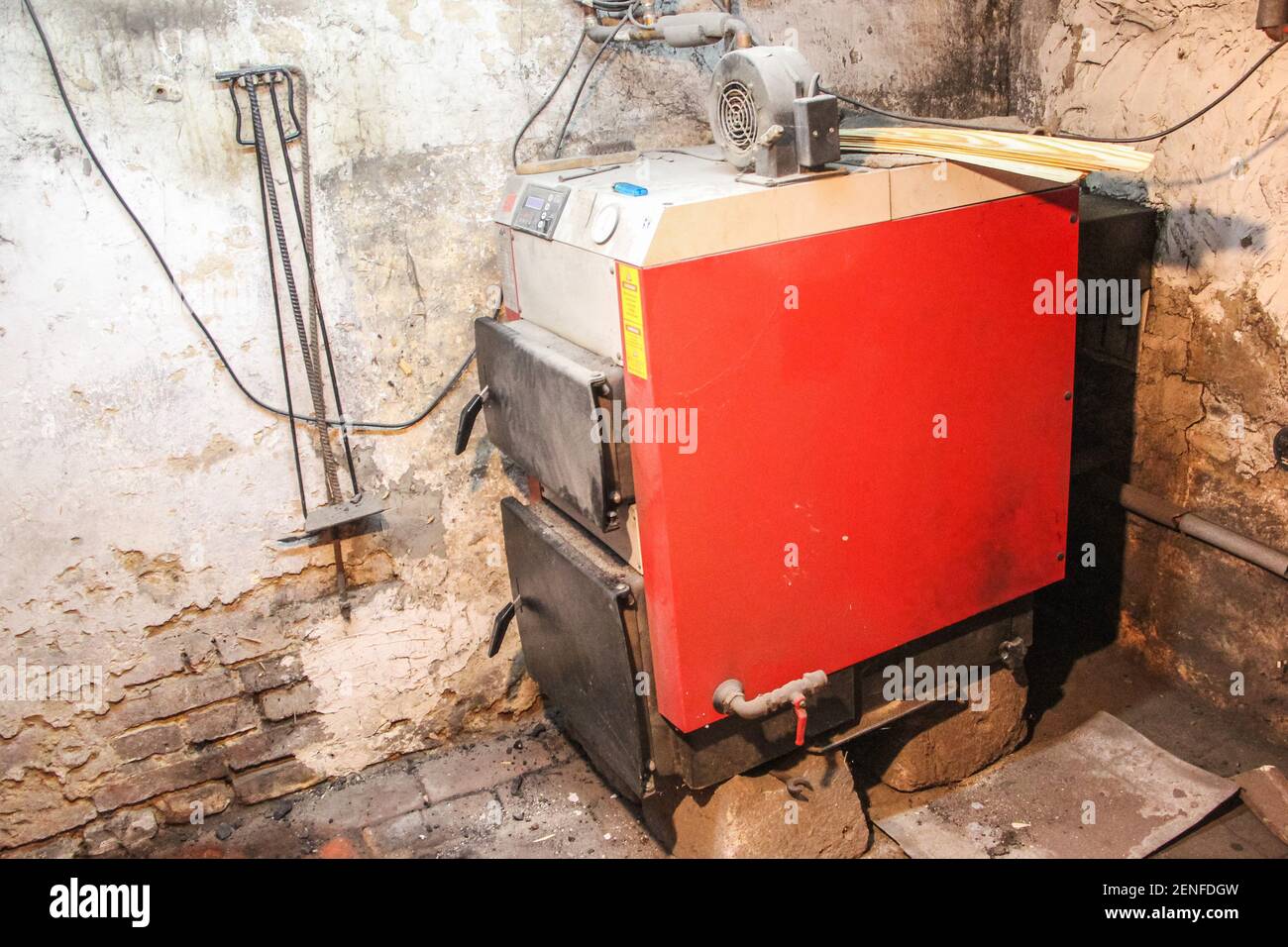 Sypniewo, Poland 10th, August 2019 A man adding wet waste anthracite ...