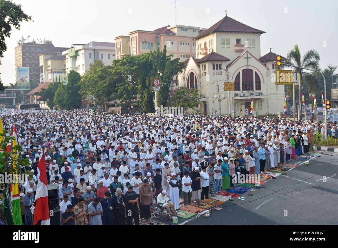 Indonesian Muslims perform Eid Al-Adha prayers a near Koinonia church ...