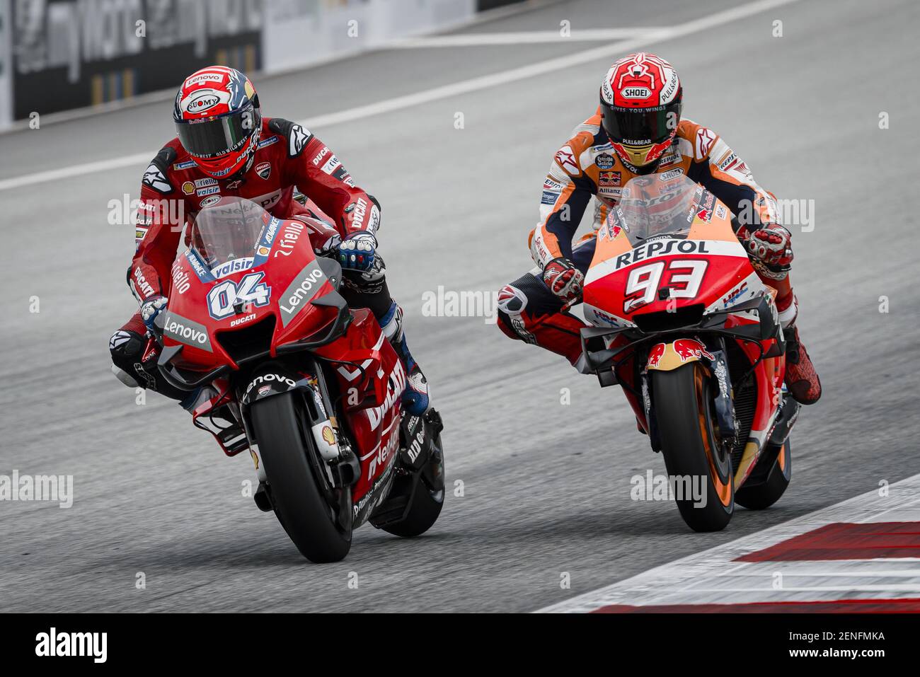Ducati Team's Italian rider Andrea Dovizioso (L) and Repsol Honda Team ...