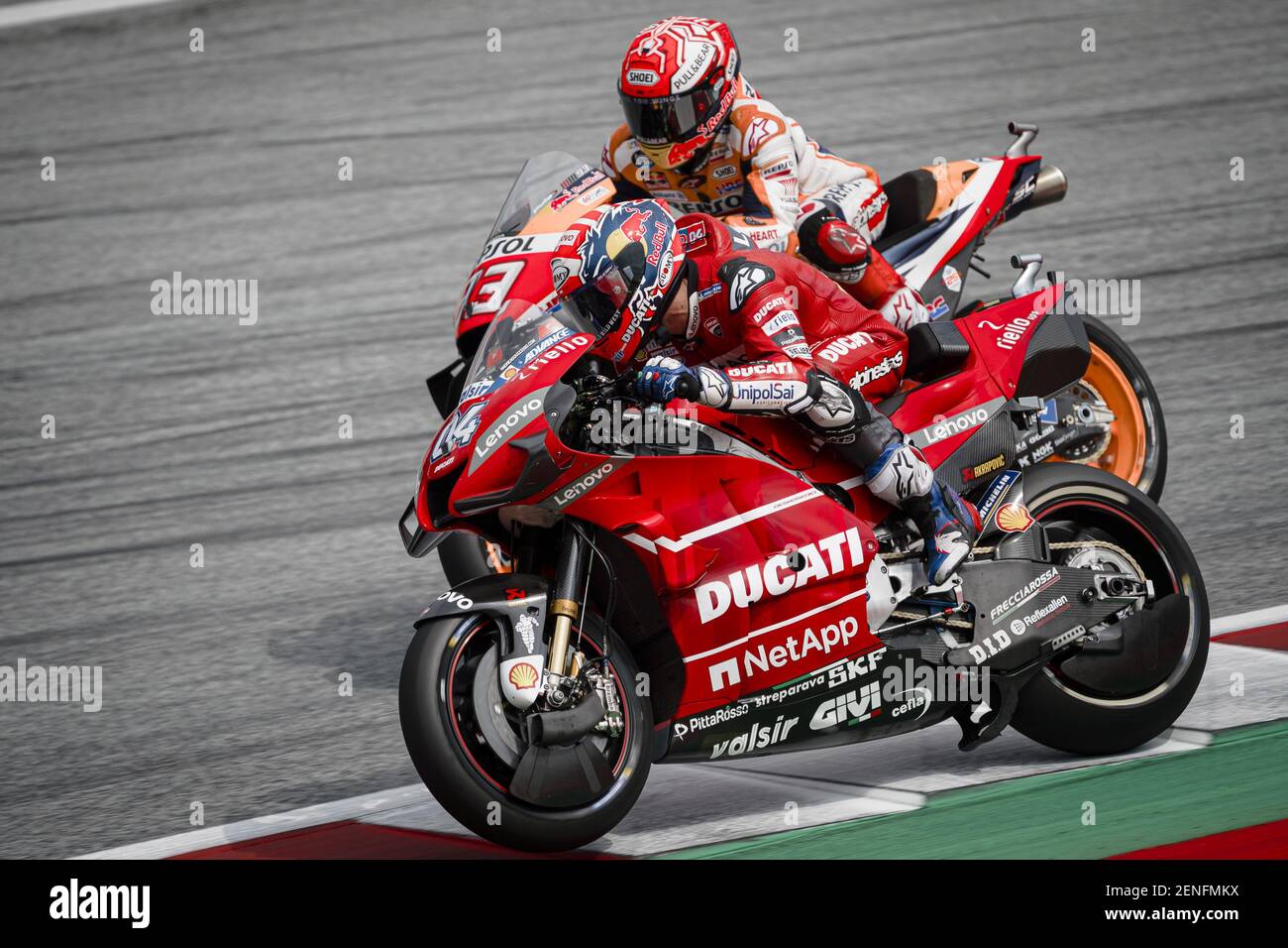 Ducati Team's Italian rider Andrea Dovizioso (front) and Repsol Honda ...