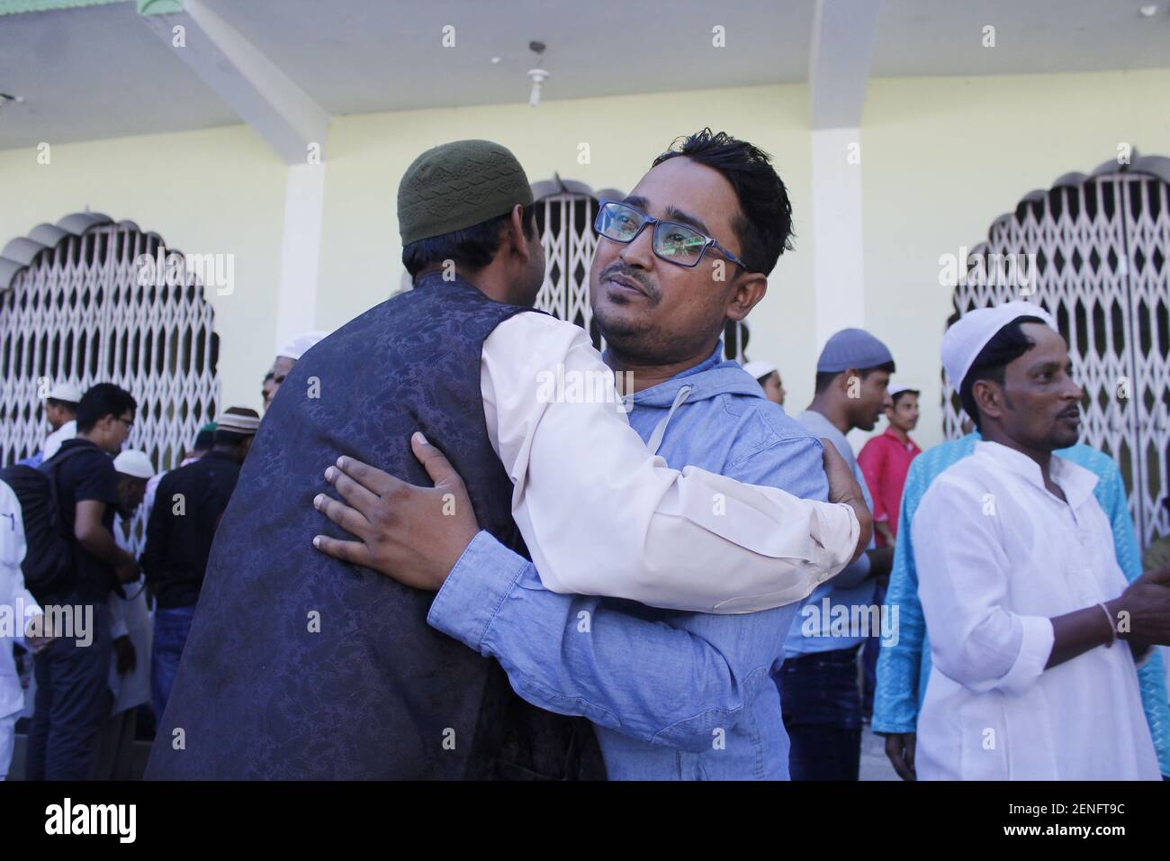 Nepali Muslims cuddle each other after offering prayers during Eid al ...