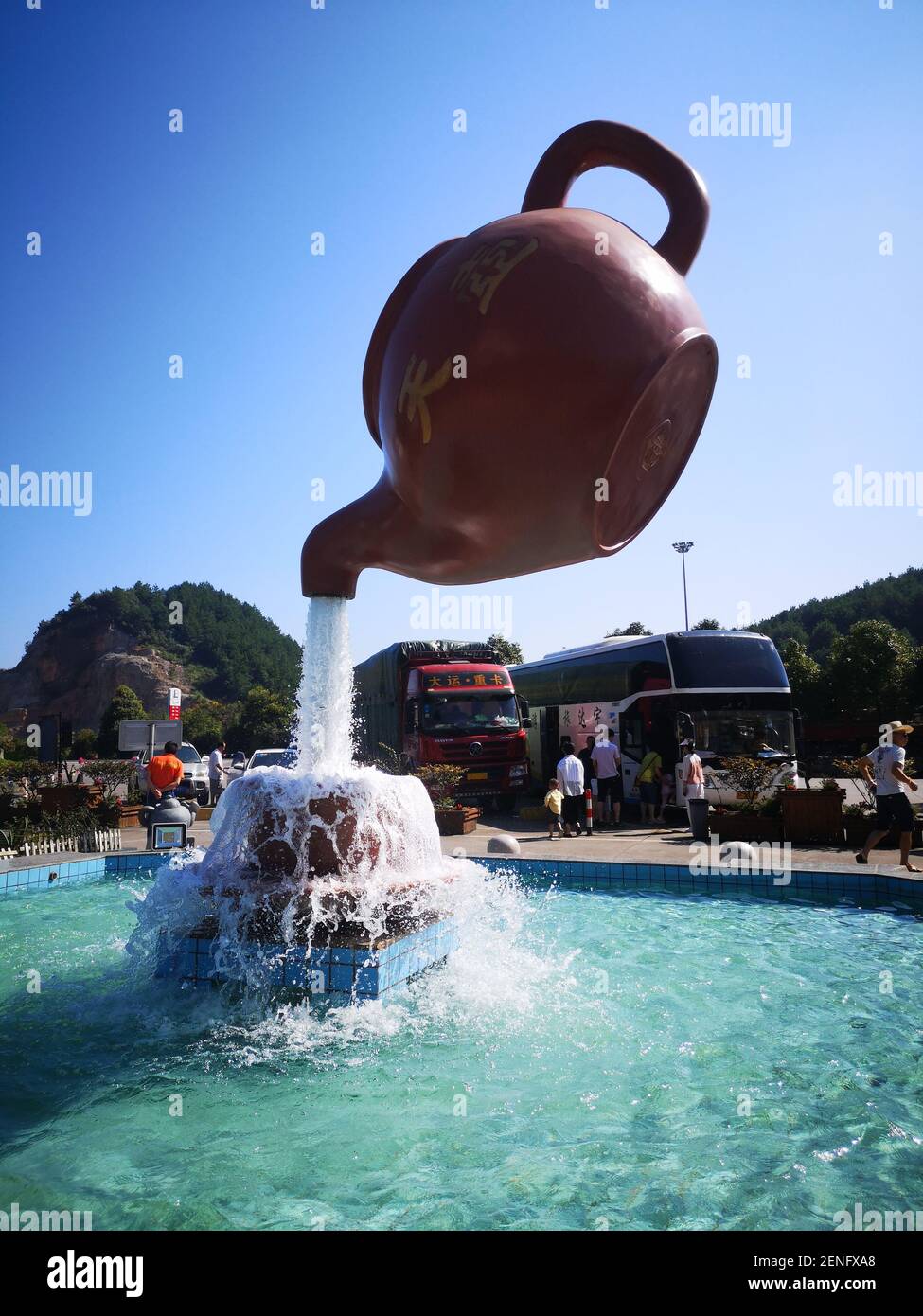 Guizhou,CHINA-A giant teapot is seen pouring water over the tianfu ...