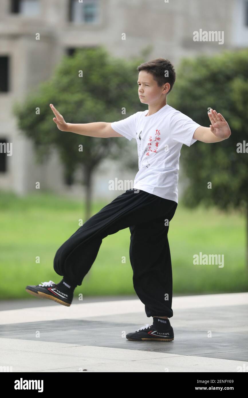 More than 60 foreign Tai chi enthusiasts practise shadow-boxing (Taiji, Taichi or Tai-chi) in ...