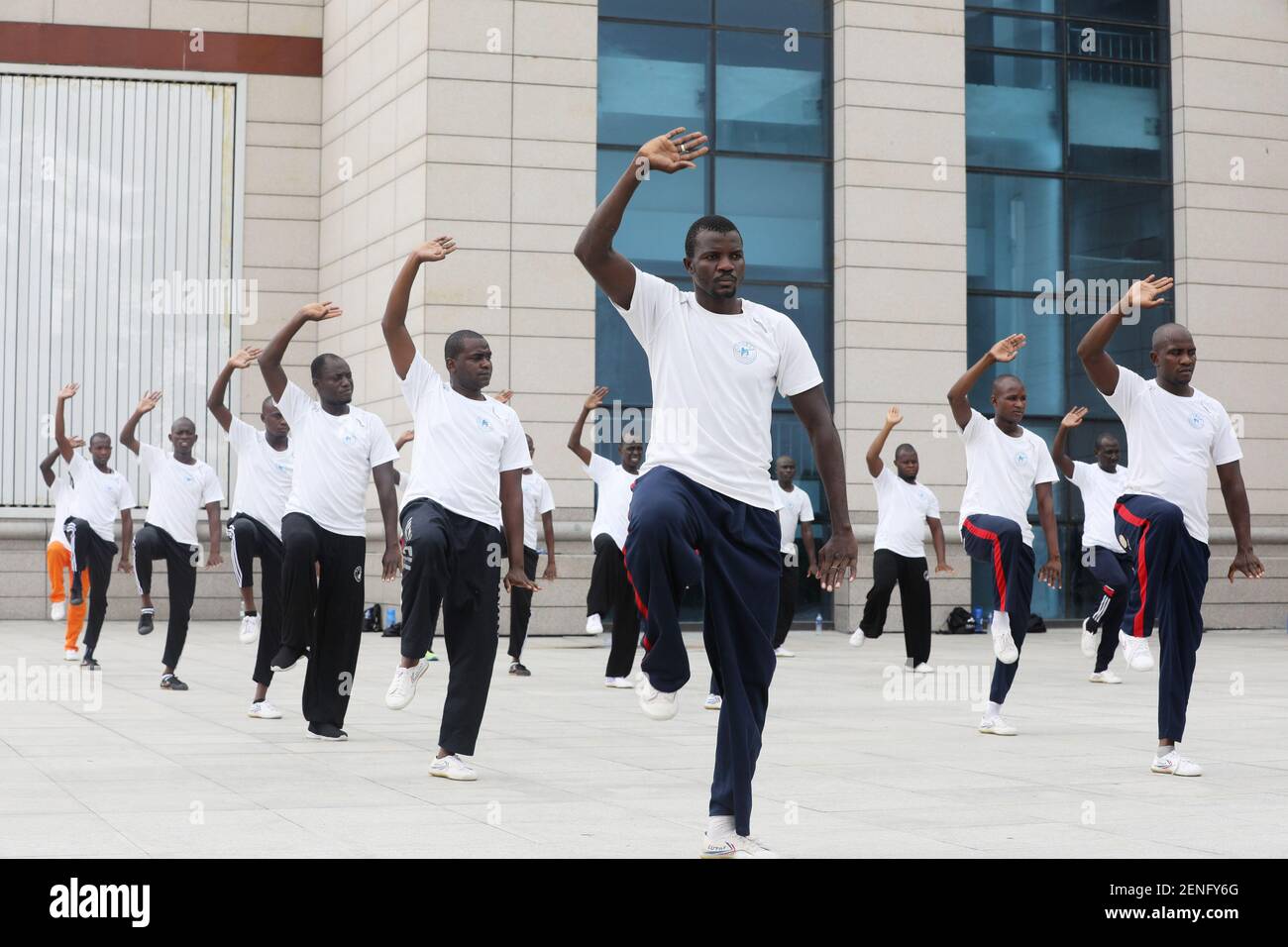 More than 60 foreign Tai chi enthusiasts practise shadow-boxing (Taiji ...
