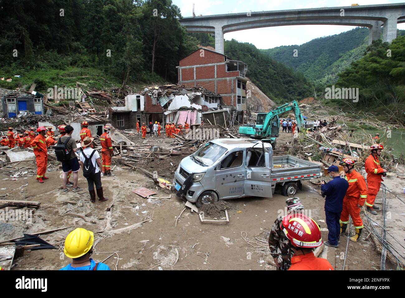 Firefighters work with villagers afterTyphoon Lekima in Shanzao village ...