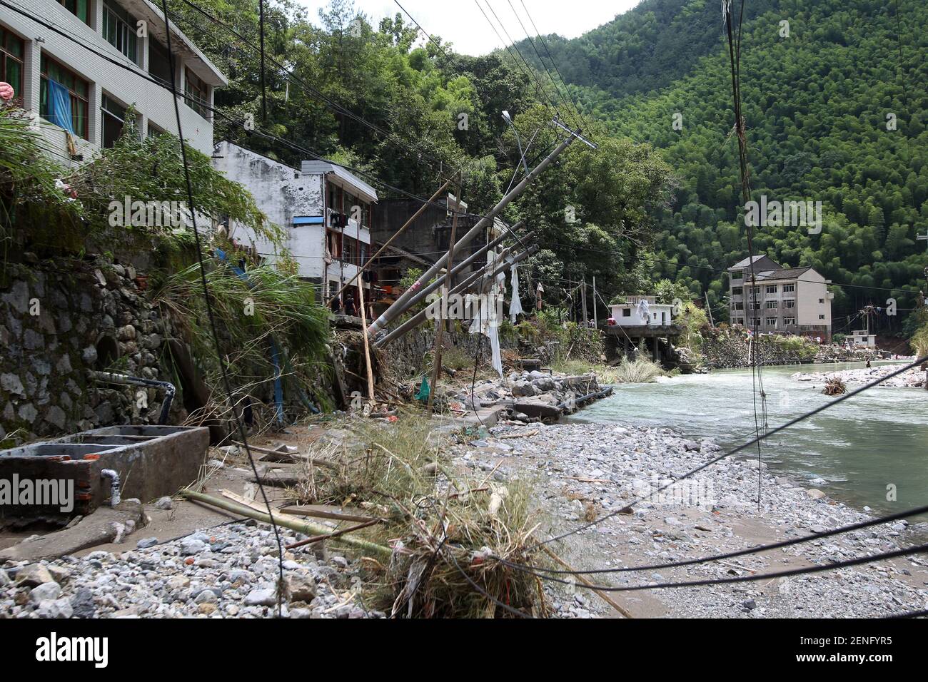 Telegraph poles get blown down by Typhoon Lekima, the 9th typhoon of ...