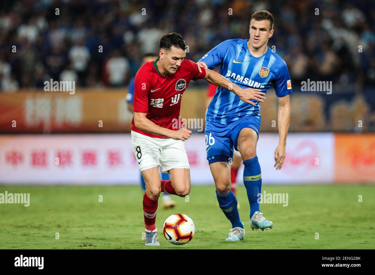 Croatian football player Ivan Santini, right, of Jiangsu Suning ...