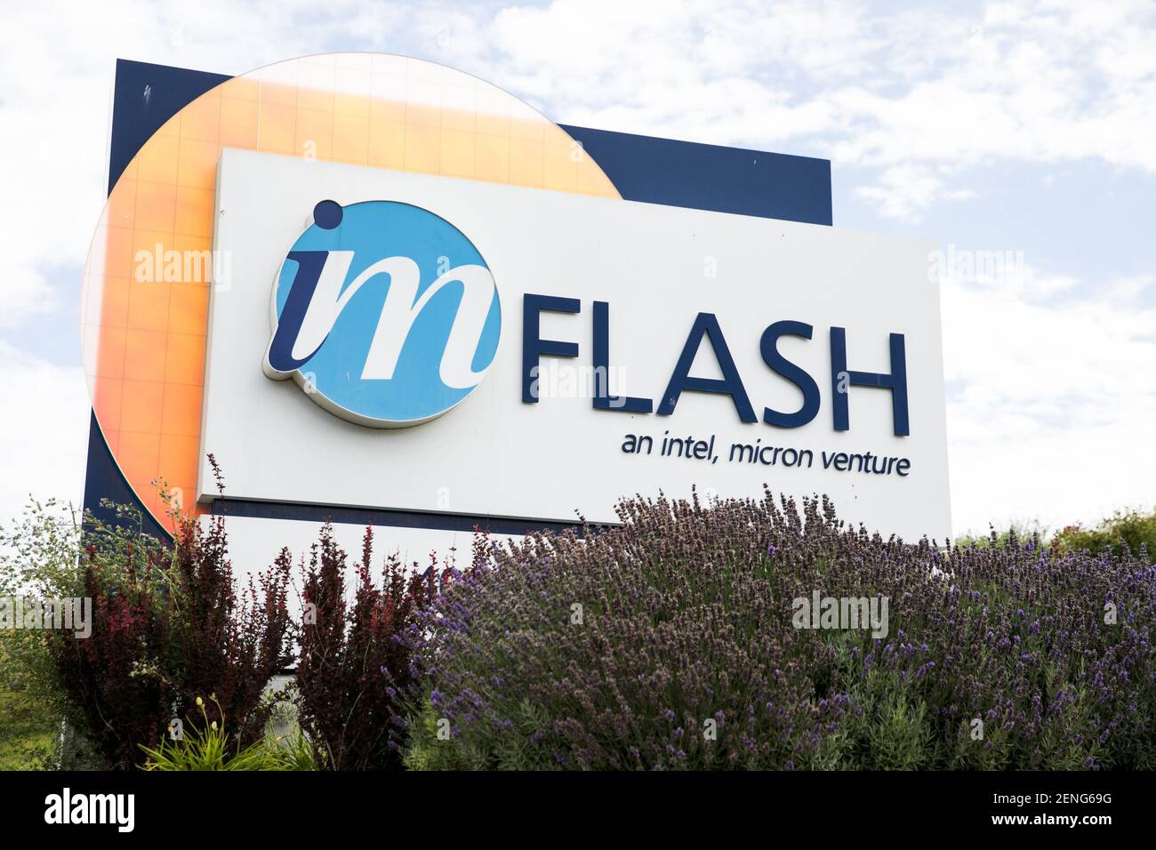 A logo sign outside of the headquarters of IM Flash Technologies in ...