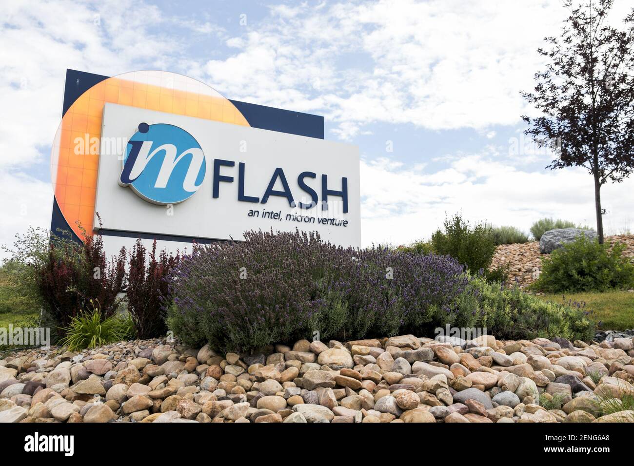 A logo sign outside of the headquarters of IM Flash Technologies in ...