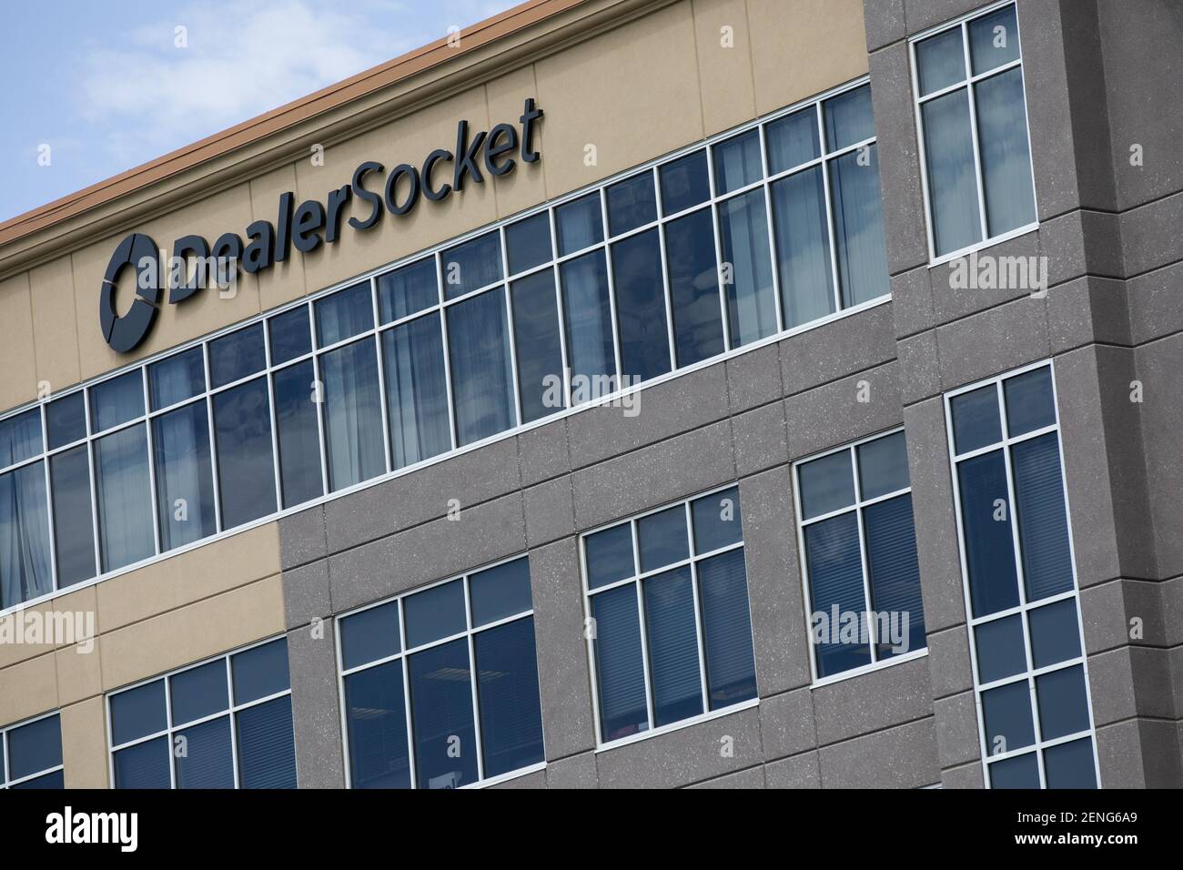 A logo sign outside of a facility occupied by DealerSocket in Draper ...