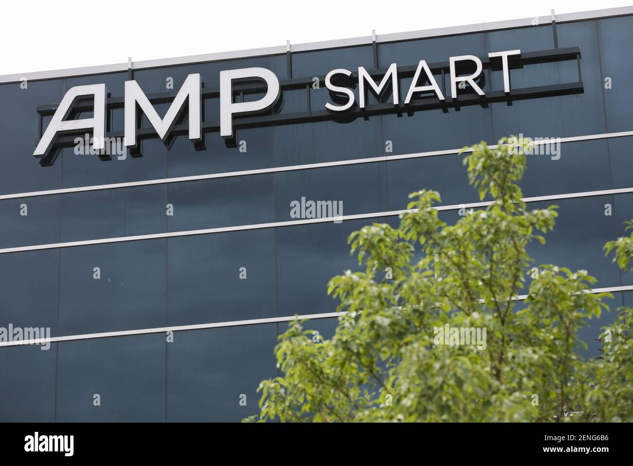 A logo sign outside of the headquarters of AMP Smart in American Fork ...