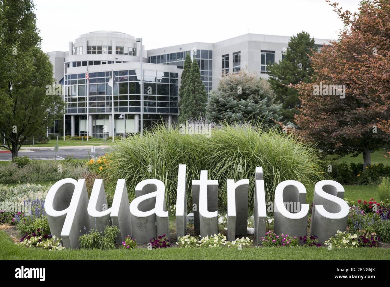 A logo sign outside of the headquarters of Qualtrics in Provo, Utah on ...