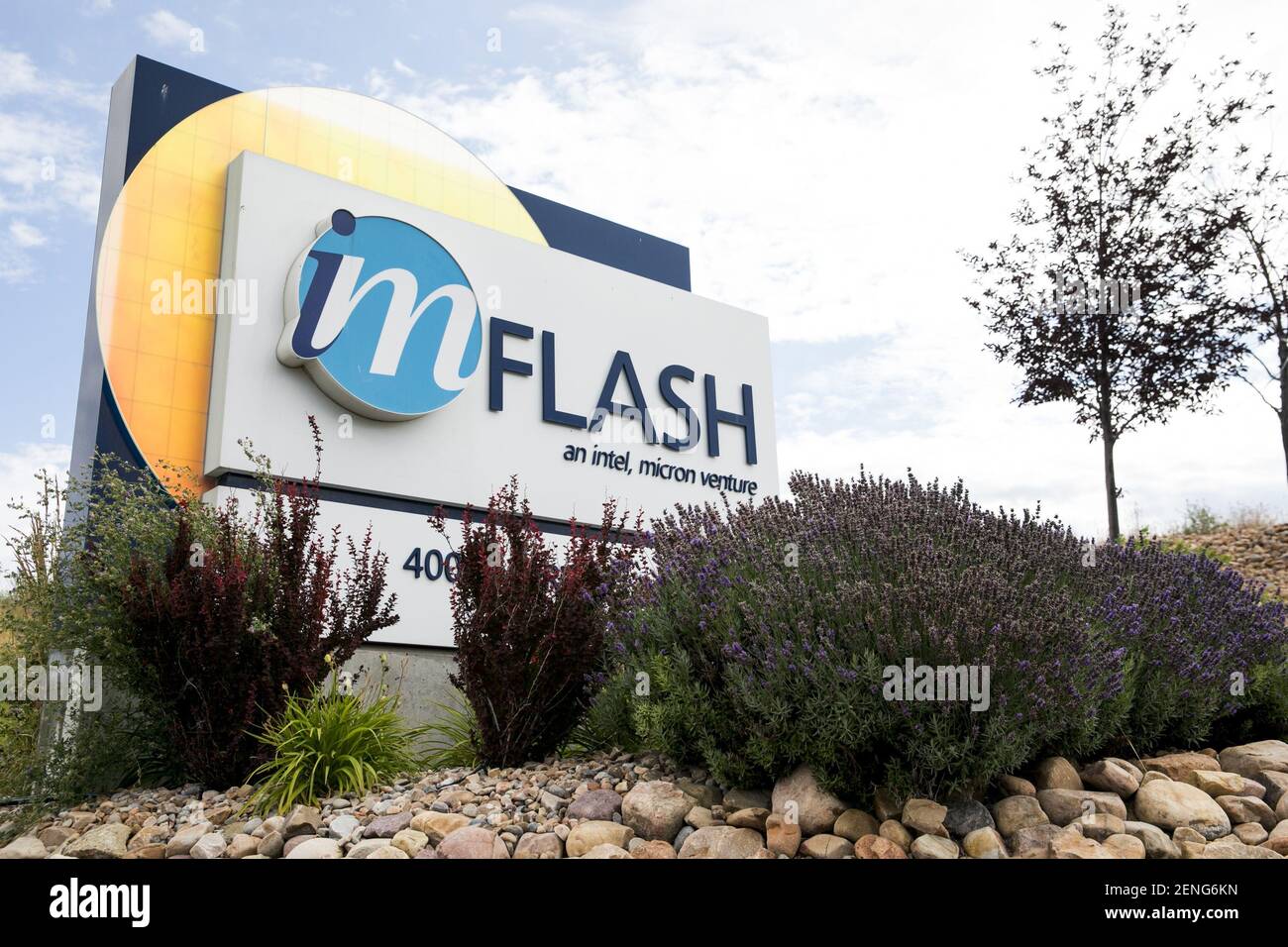 A logo sign outside of the headquarters of IM Flash Technologies in ...