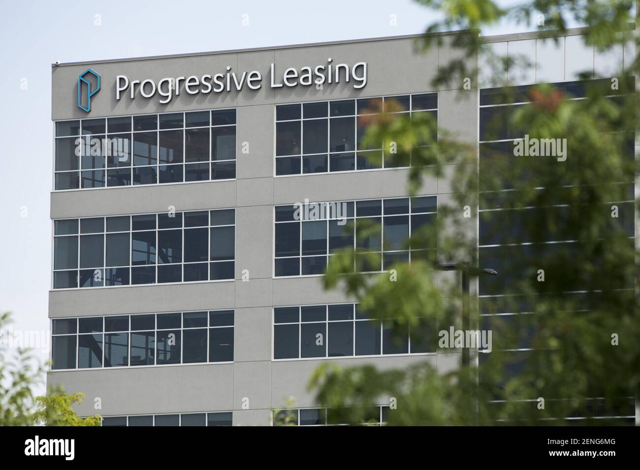 A logo sign outside of the headquarters of Progressive Leasing in ...
