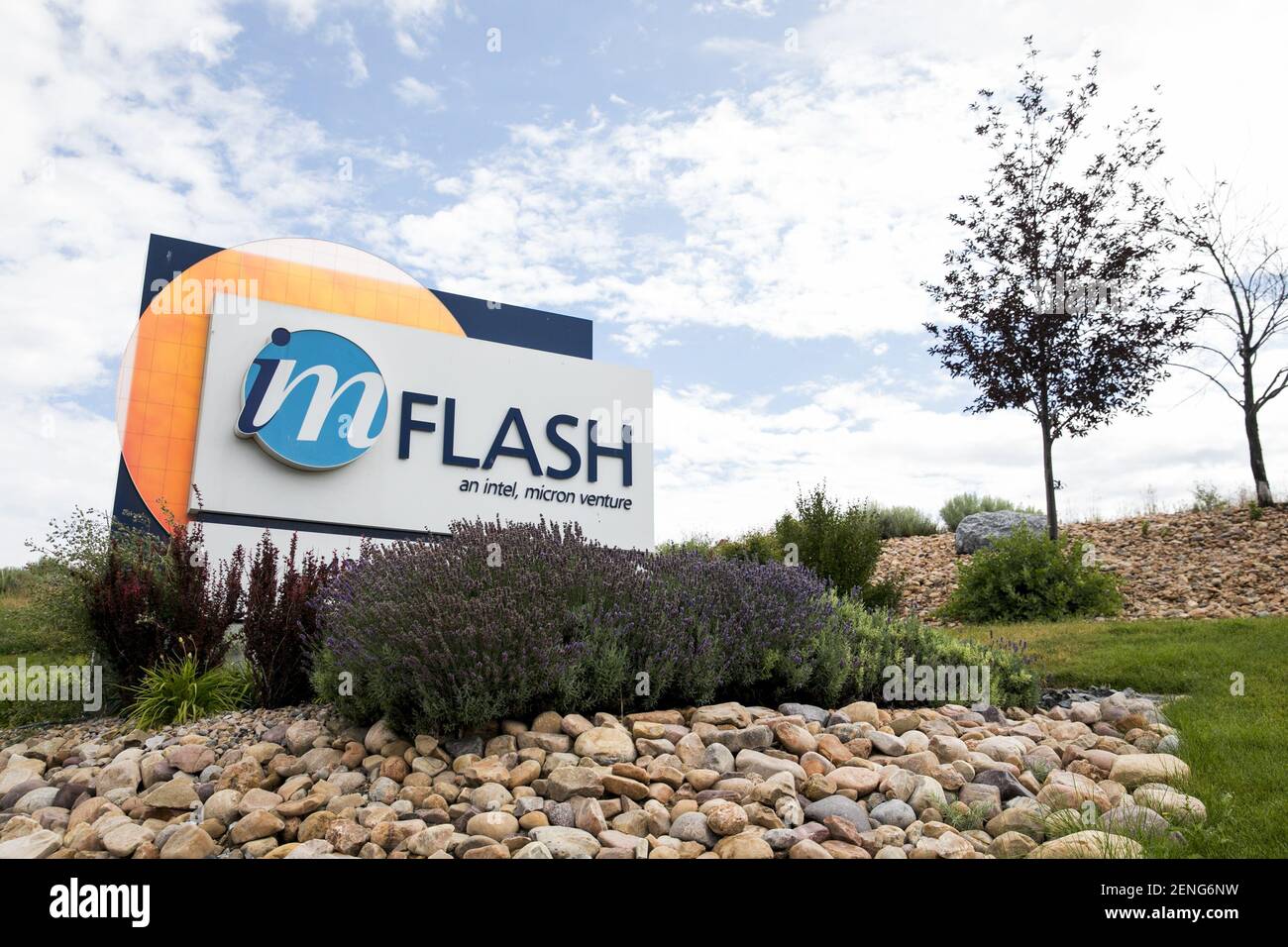 A logo sign outside of the headquarters of IM Flash Technologies in ...