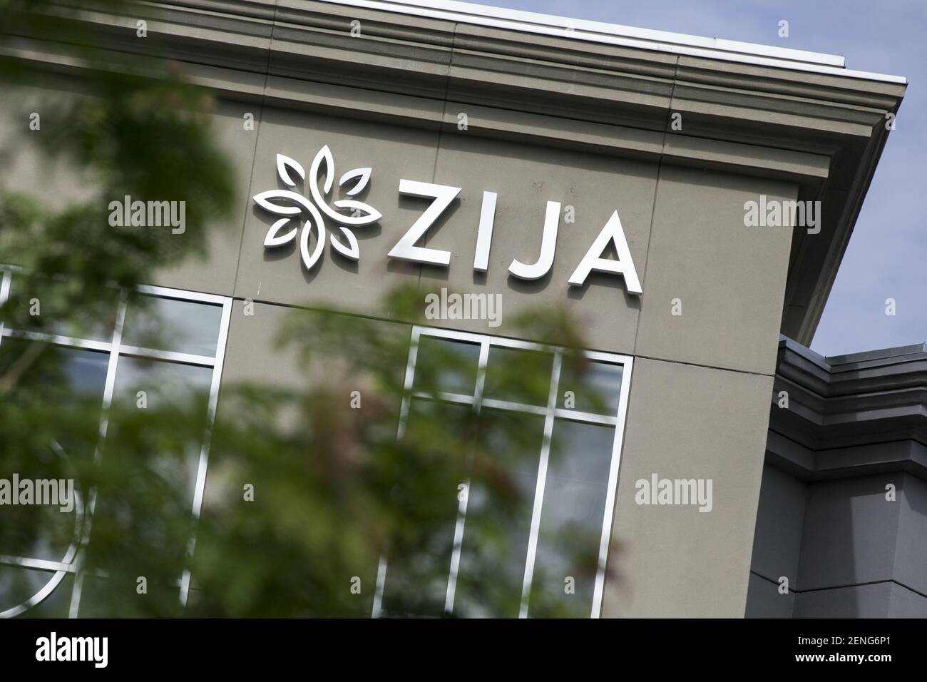 A logo sign outside of a facility occupied by Zija International in ...