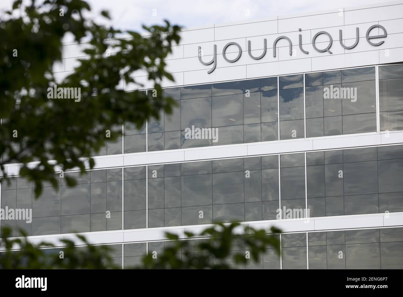 A logo sign outside of the headquarters of Younique in Lehi, Utah on ...
