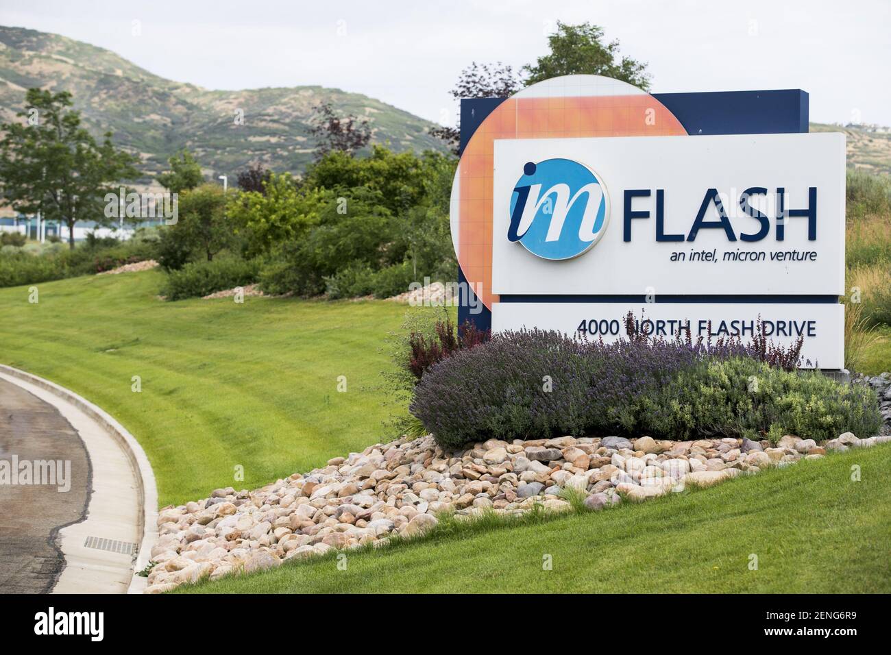 A logo sign outside of the headquarters of IM Flash Technologies in ...