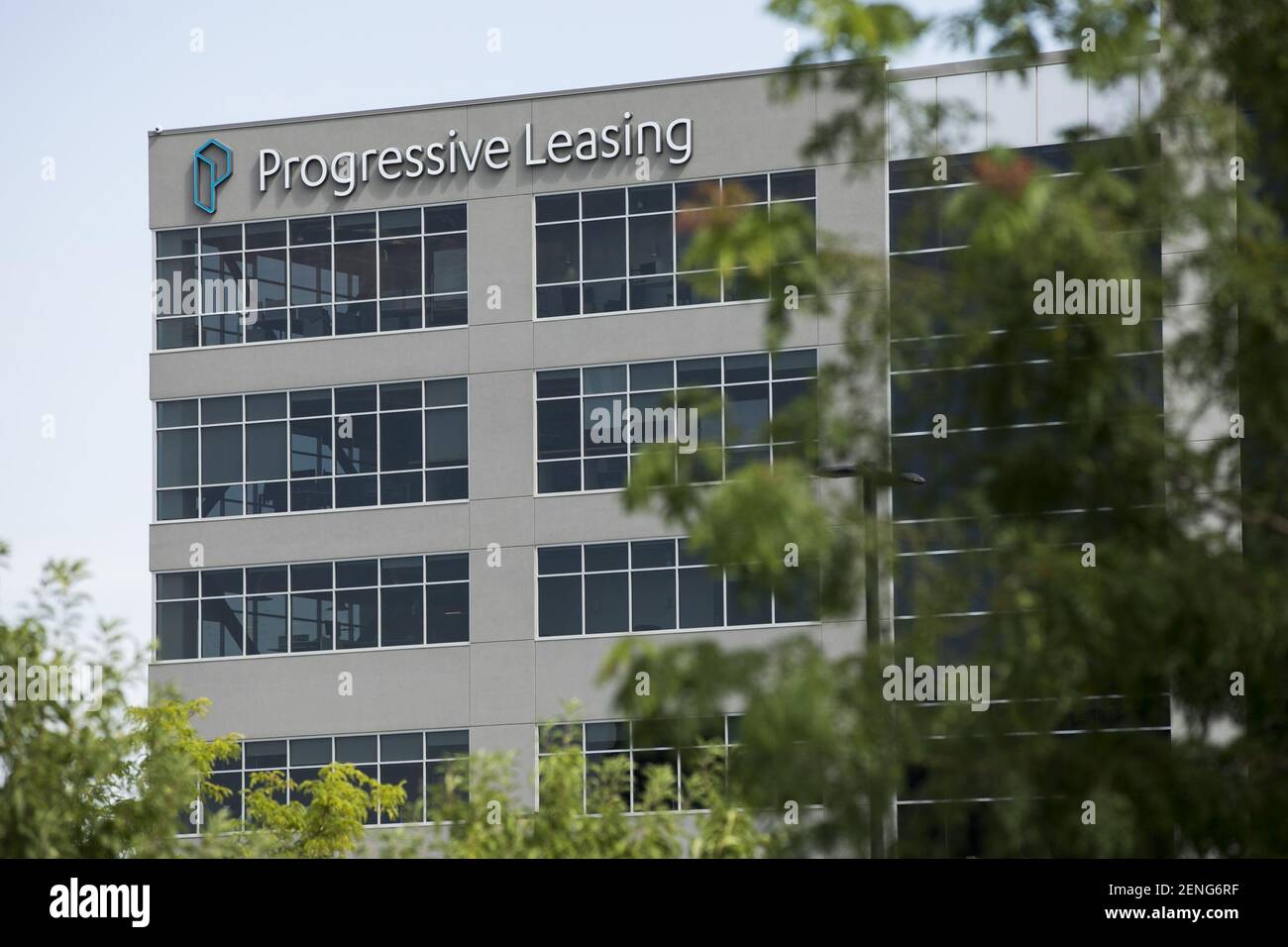 A logo sign outside of the headquarters of Progressive Leasing in ...
