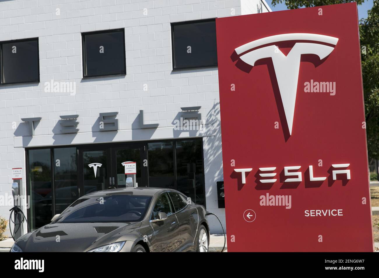 A logo sign outside of a Tesla car dealership in Salt Lake City, Utah ...