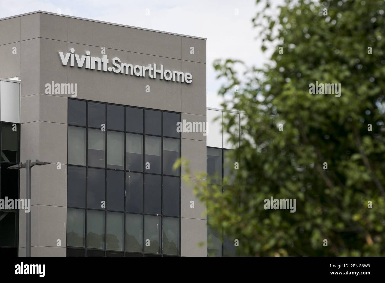 A logo sign outside of a facility occupied by Vivint Smart Home in Lehi ...