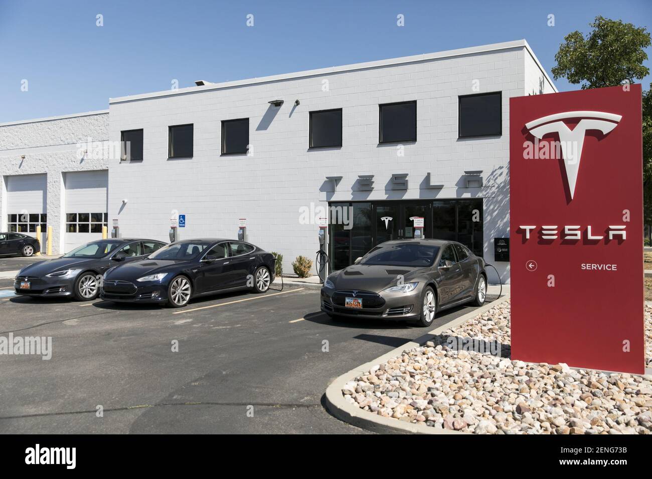 A logo sign outside of a Tesla car dealership in Salt Lake City, Utah ...