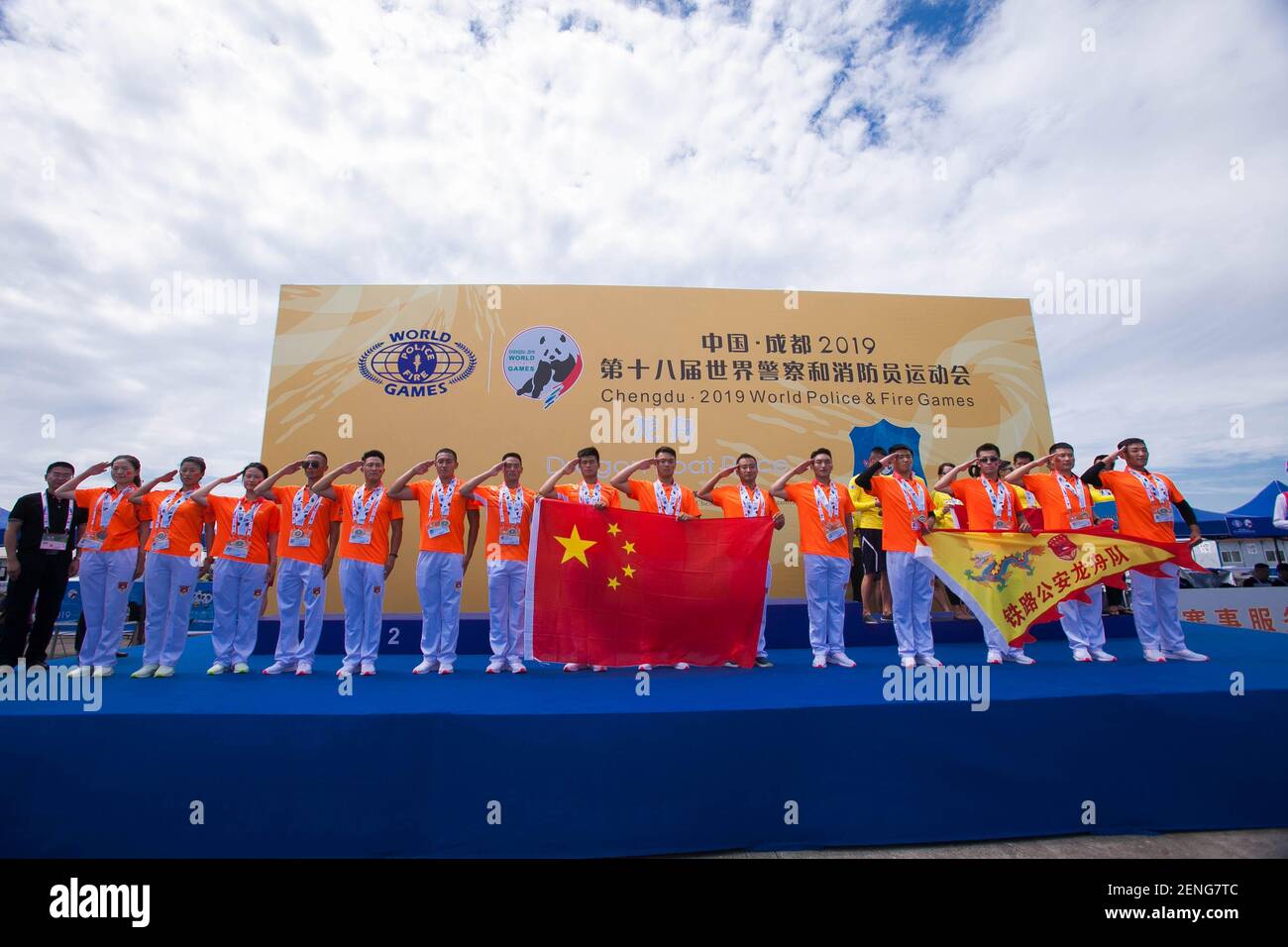Police officers and firefighters attend the dragon boat races during ...
