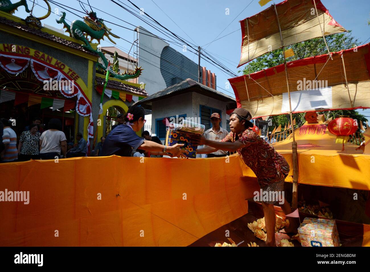 Confucians prepare a replica house and ship made of paper, before ...