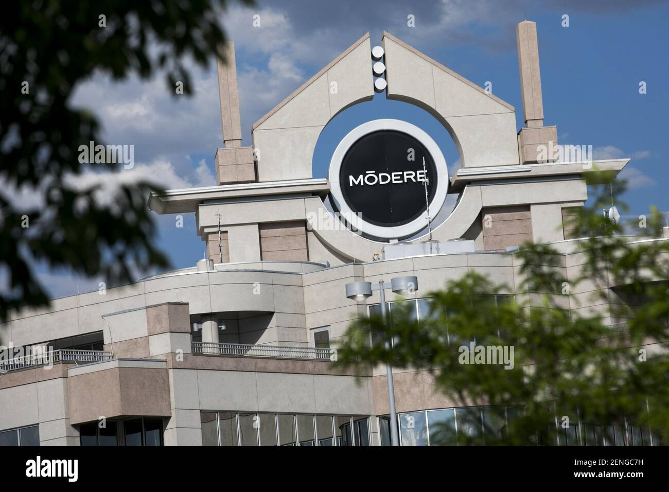 A logo sign outside of the headquarters of Modere in Springville, Utah ...
